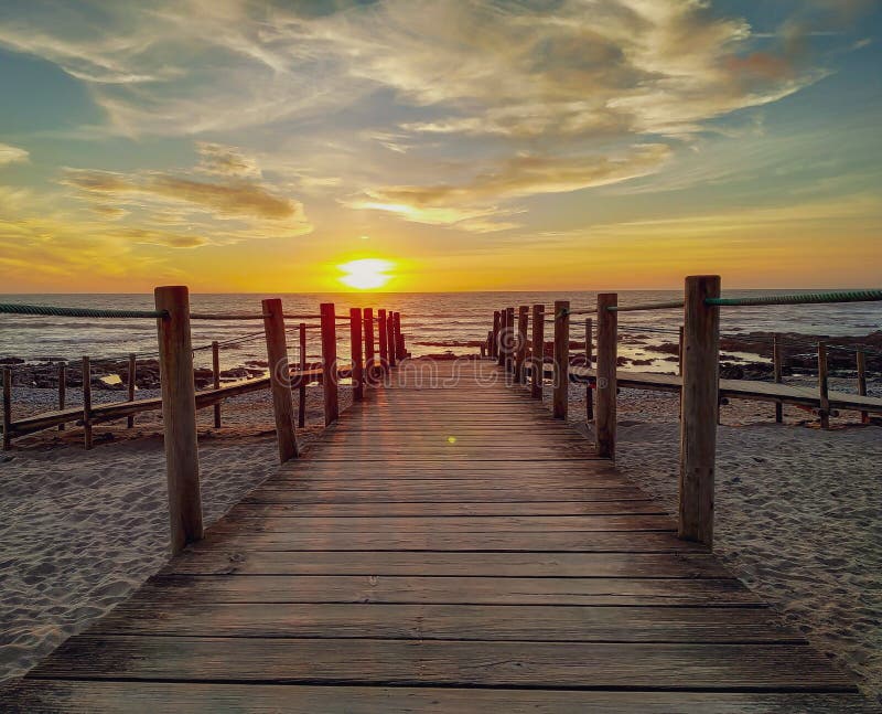 Mesmerizing Scenery of Wooded Bridge in the Port at Sunset Stock Image ...