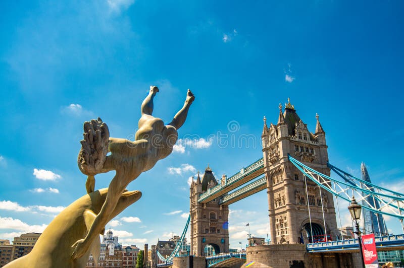 Mesmerizing Sculpture of a Man and a Dolphin with the Tower Bridge in ...