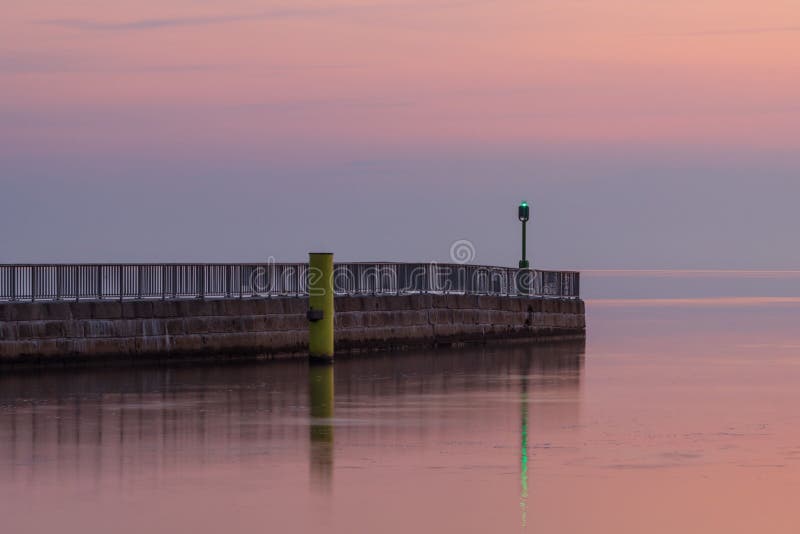 Mesmerizing Sea View with Stone Pier Under Pinky Sunset Sky Stock Image ...