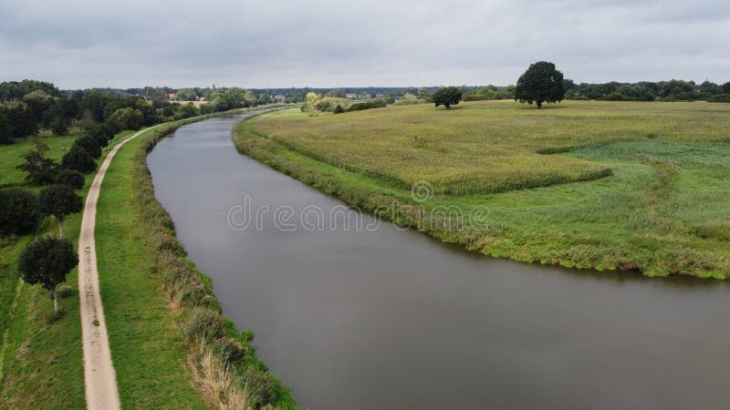 Mesmerizing Shot of a Narrow Lake Surrounded by Greenery Stock Photo ...