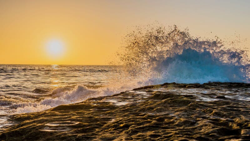 Mesmerizing Shot of the Sun on the Skyline at the Dusk, Water Splash of ...