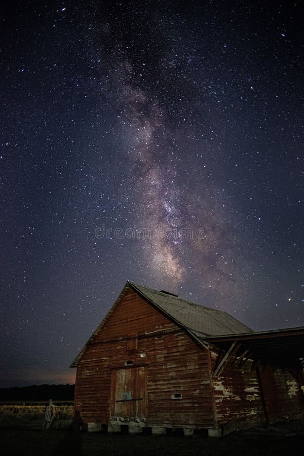 Mesmerizing Vertical View of the Magical Starry Night Over an Old ...