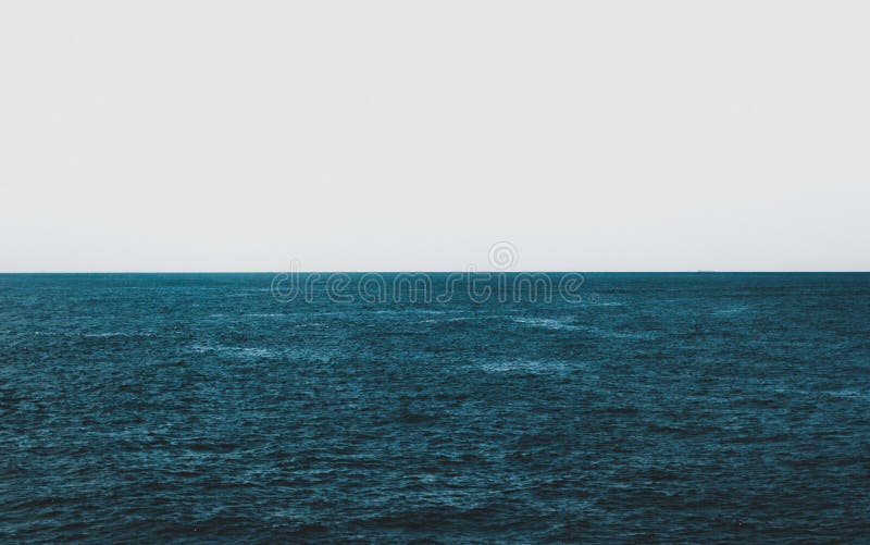 Mesmerizing View of the Calm Ocean Under the Blue Sky - Perfect for ...