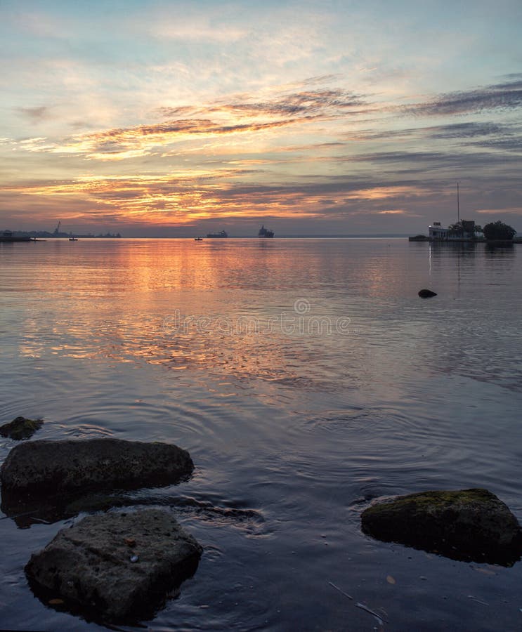 Mesmerizing View of a Dramatic Sunset Sky Over the Calm Sea Stock Photo ...