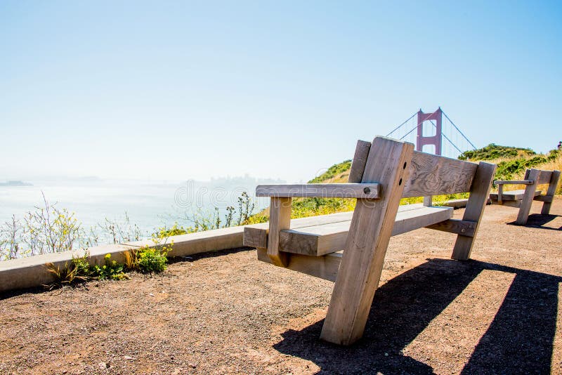 Mesmerizing View of the Golden Gate Bridge with a Wooden Bench on the ...