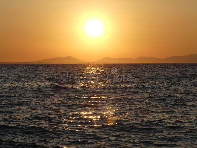 Mesmerizing View of a Partially Rough Sea during a Beautiful Sunset ...