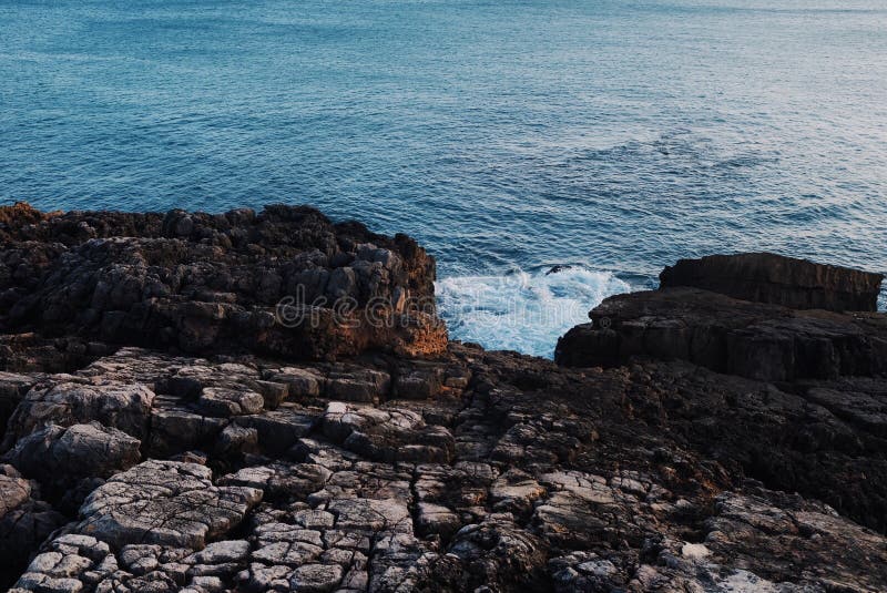 Mesmerizing View of Rocks with the Ocean in the Background Stock Image ...