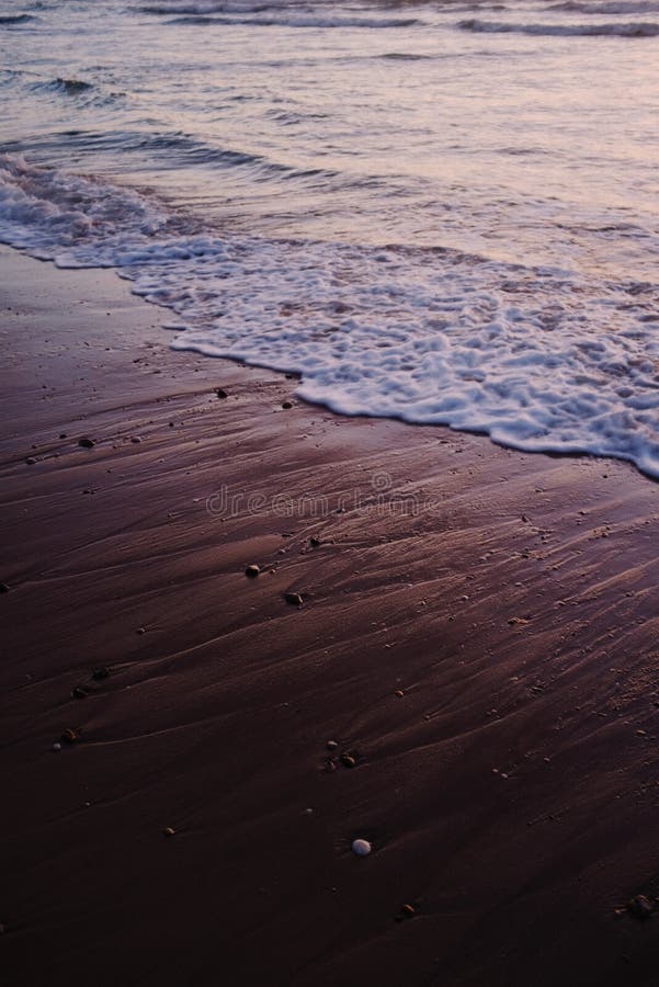 Mesmerizing View of Shallow Water on a Beach at Sunset Stock Image ...