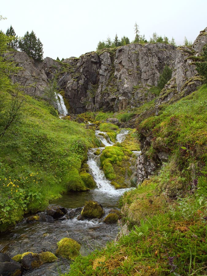 Mesmerizing View of a Waterfall in Seydisfjordur, Iceland Stock Image ...