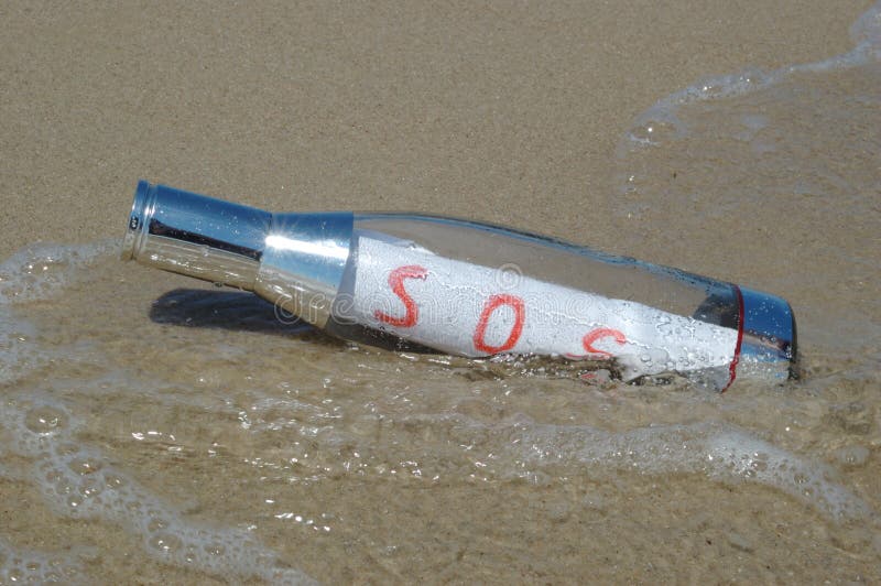Message In A Bottle With SOS Signal Lying In Surf Picture. Image: 5769976