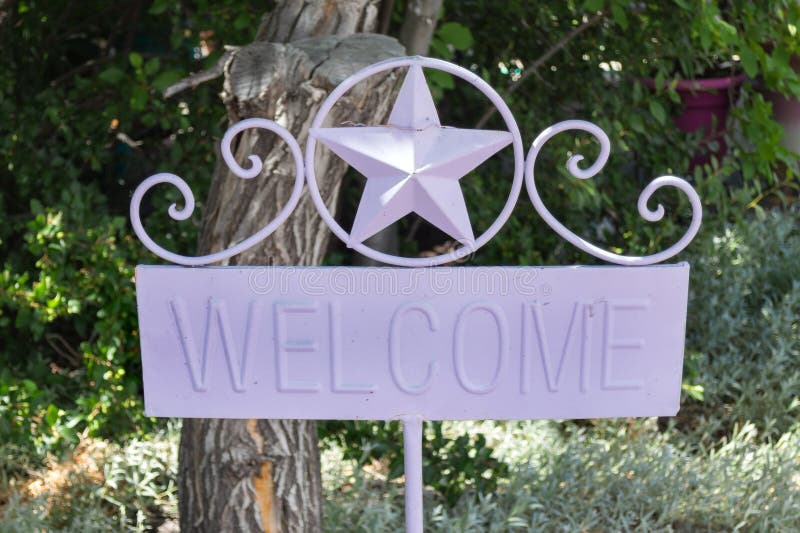 Welcome sign in the garden stock image. Image of close - 188797617