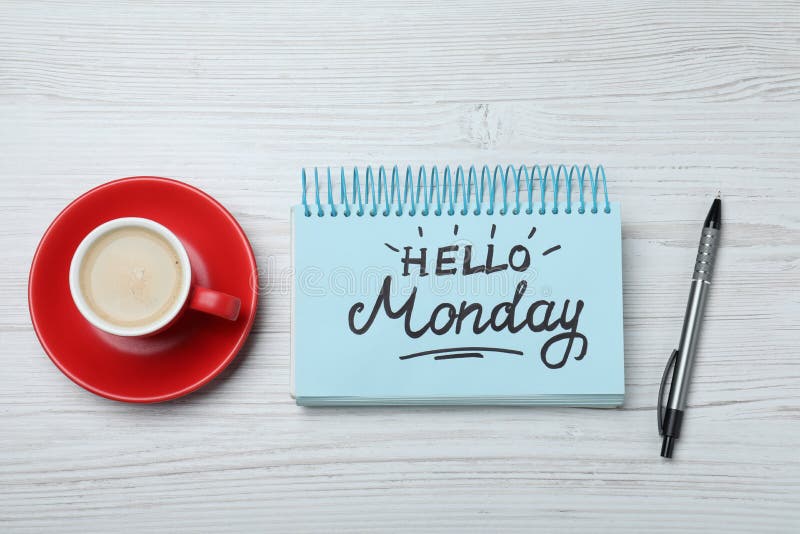 Message Hello Monday Written in Notebook, Pen and Cup of Coffee on ...