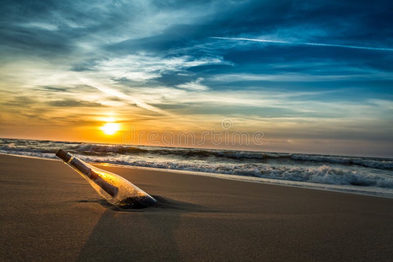 Message in a Bottle on a Sea Shore Stock Photo - Image of fluffy, blue ...