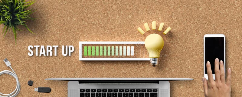 Message START UP with a Loading Bar and Hand Over a Smartphone and ...