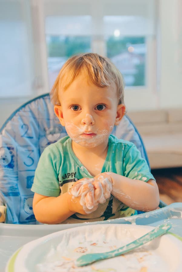 Messy baby eating food stock photo. Image of child, color - 149944006