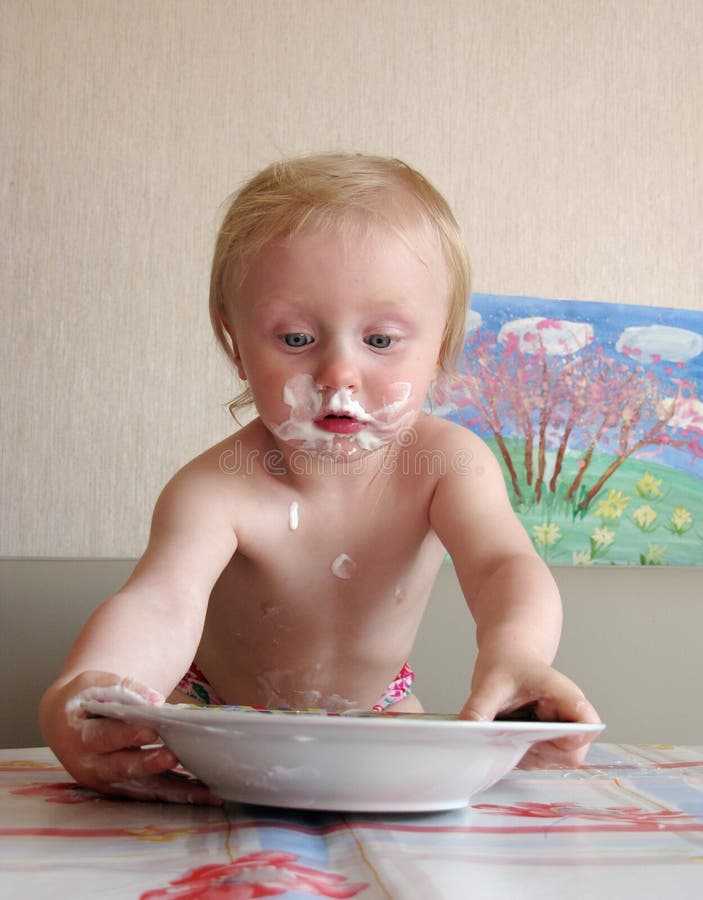 Messy baby with plate stock photo. Image of dish, girl - 24731280