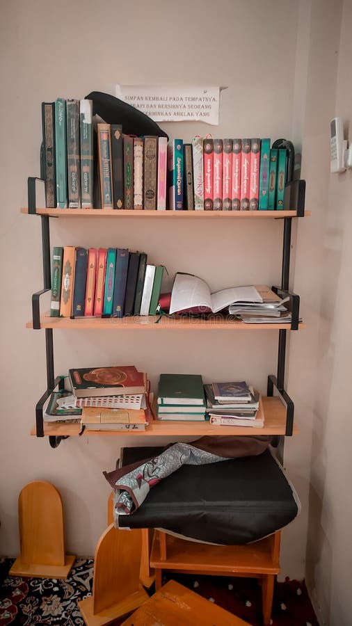 Messy Bookshelves in a Library Editorial Photo - Image of room ...
