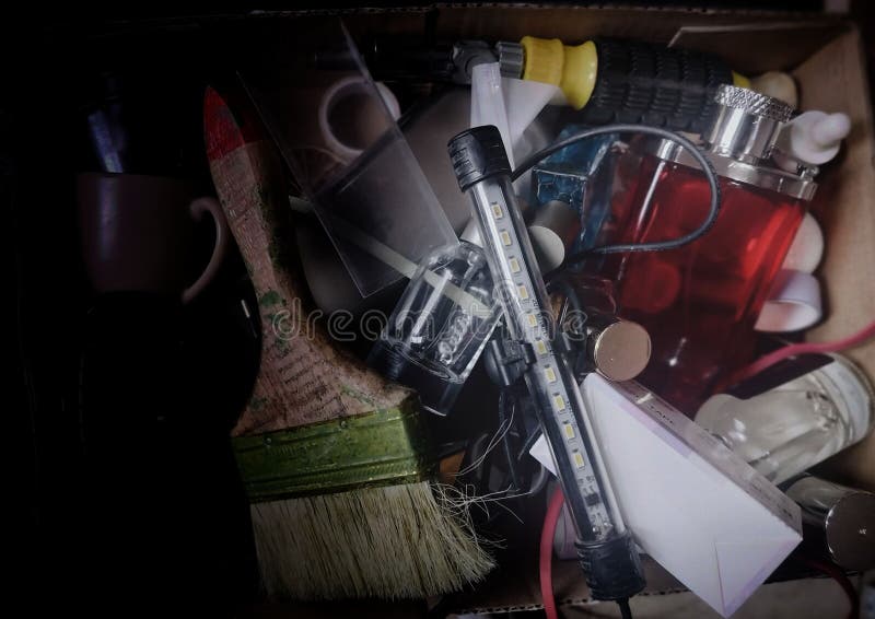A Messy Box Filled with Old Bottles and Forgotten Objects Stock Photo ...