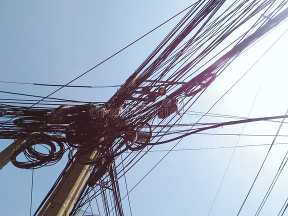 Messy Cable Wire on Electric Pole Against Blue Sky Stock Photo - Image ...