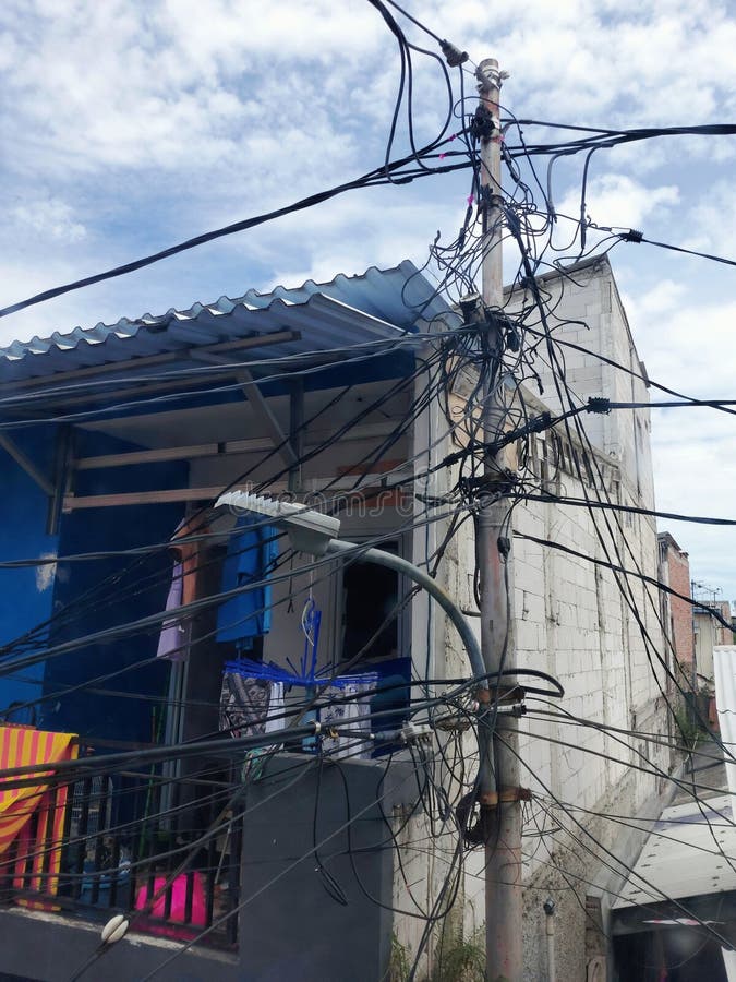 Messy cables in the city editorial stock photo. Image of cables - 261959313