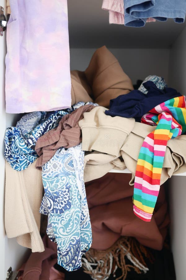 Messy Closet with Piled Clothes and Colorful Accessories, Displaying ...