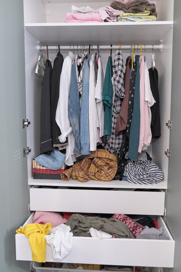Messy Clothes Thrown on a Shelf. Dressing Room Mess, Decluttering ...