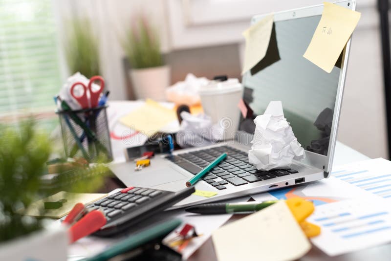Messy and cluttered desk stock photo. Image of mess - 229743144
