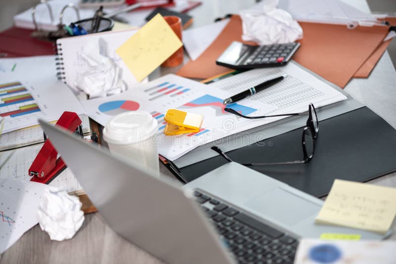 Messy and cluttered desk stock image. Image of place - 192528907