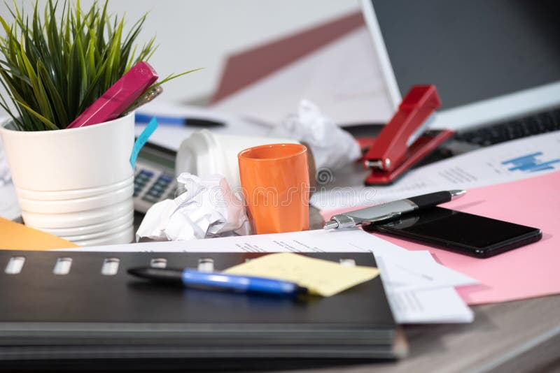 Messy and cluttered desk stock photo. Image of paper - 192853948