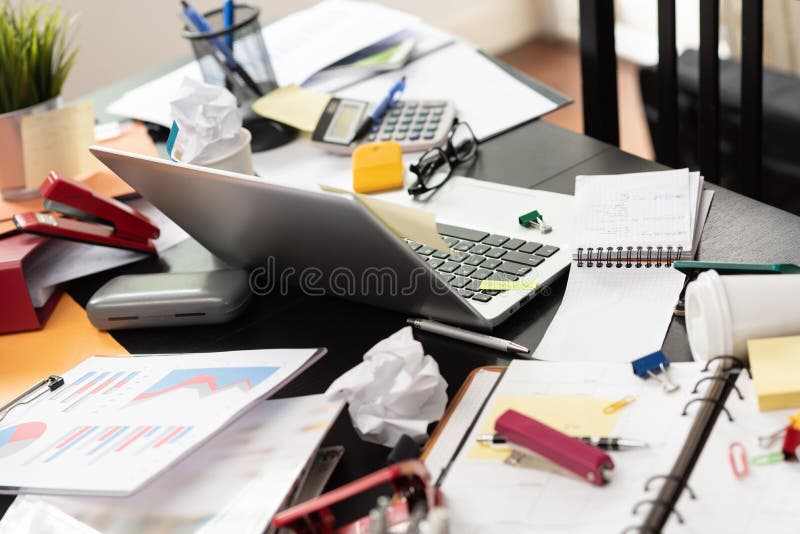 Messy and cluttered desk stock photo. Image of paper - 198712478