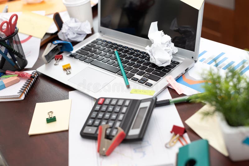 Messy and cluttered desk stock photo. Image of office - 246225248
