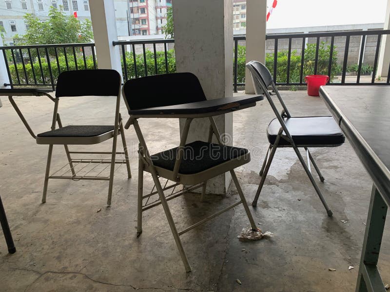 A Messy Collection of Empty Chairs in a Shabby Room Stock Image - Image ...