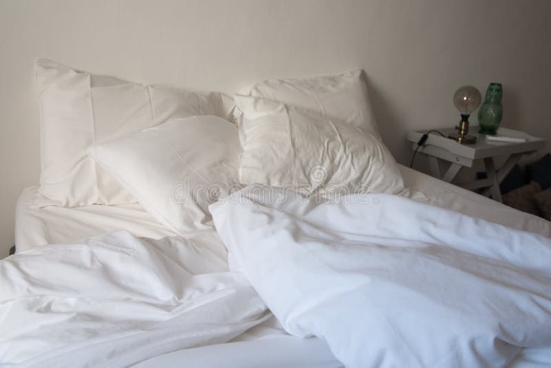 Messy Empty Bed Early in the Morning. Hotel White Bedding Stock Image ...