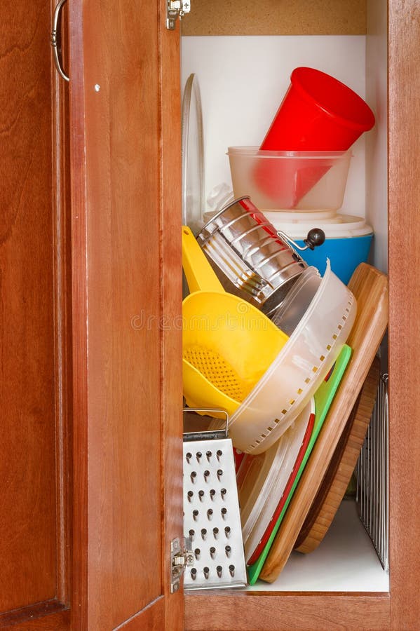 Messy Kitchen Cabinet or Cupboard Stock Photo - Image of utensils ...