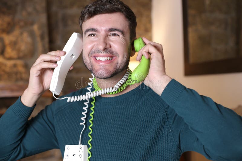 Messy Man Using Two Landline Telephones at the Same Time Stock Image ...