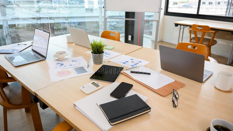 Messy Office Meeting Table with Notebook Laptop, Tablet and Stuff Stock ...
