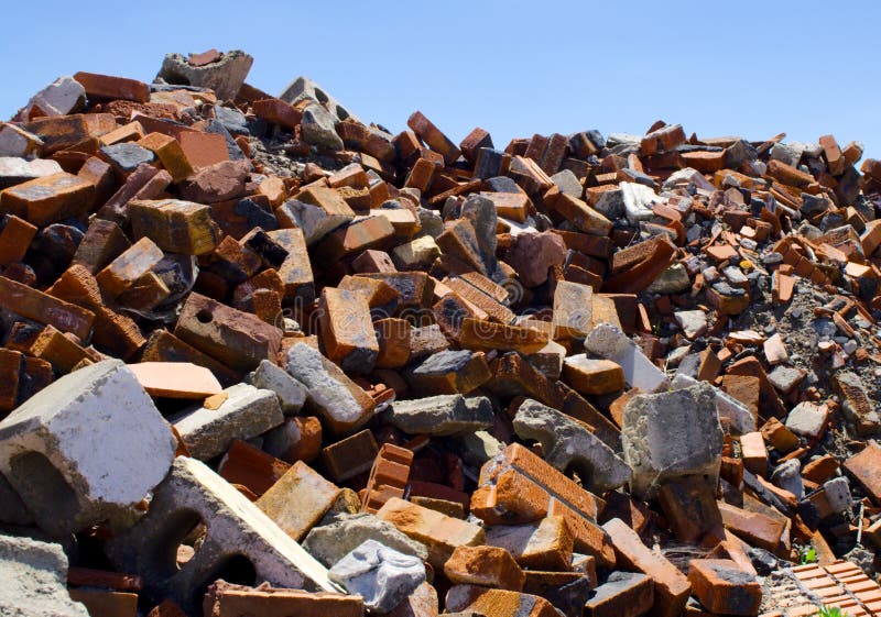 Messy Pile of Bricks on Blue Sky Stock Photo - Image of mortar ...