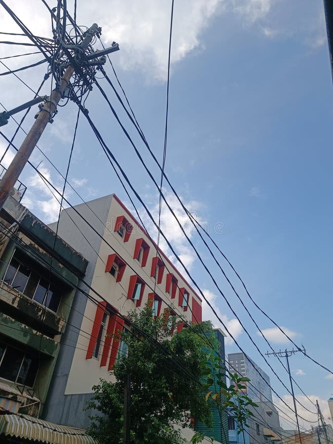 Between Messy Power Lines and Office Building Stock Photo - Image of ...