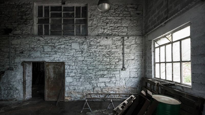 Messy Room with Stacks of Metal and a Concrete Brick Wall of a Building ...