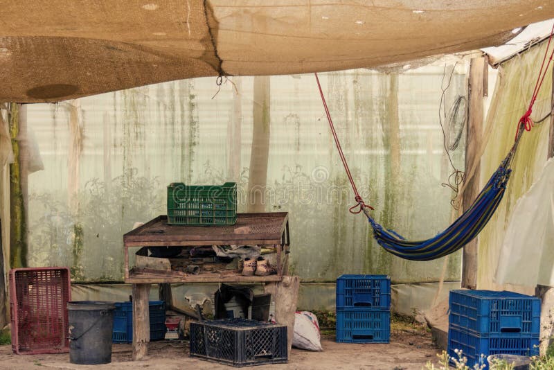 A Messy Rustic Shack Made Out of Plastic, with a Wooden Rickety Table ...