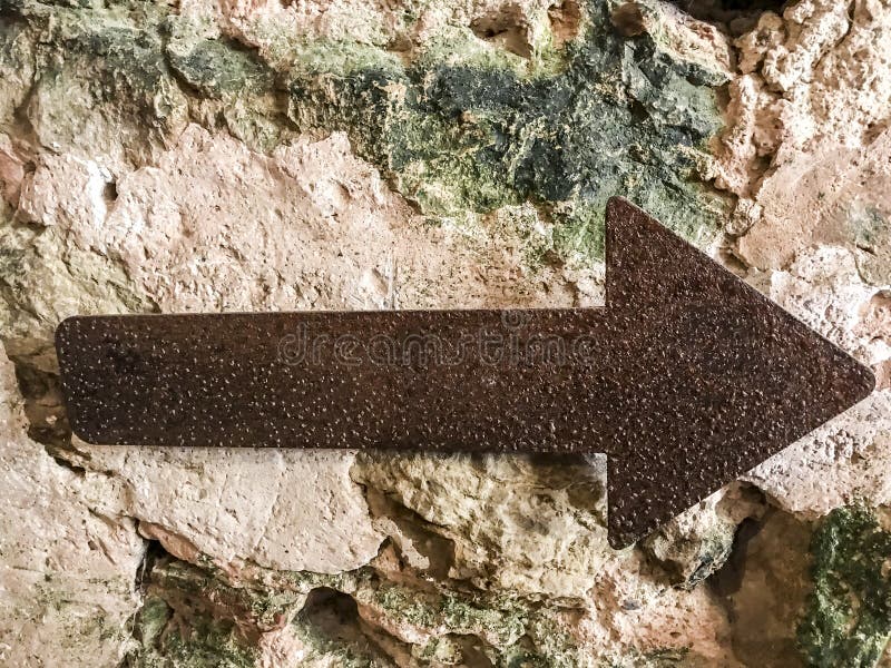 Metal Arrow Guide on the Wall Stock Photo - Image of metallic, isolated ...