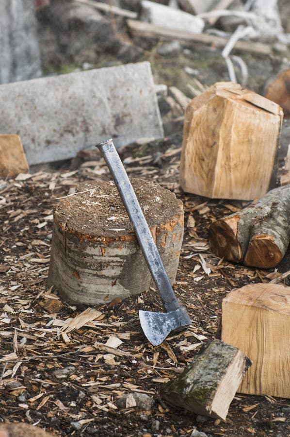 Metal axe for cutting logs stock photo. Image of piece - 235748246