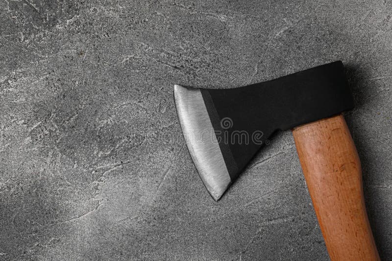 Metal Axe with Wooden Handle on Grey Textured Table, Top View. Space ...