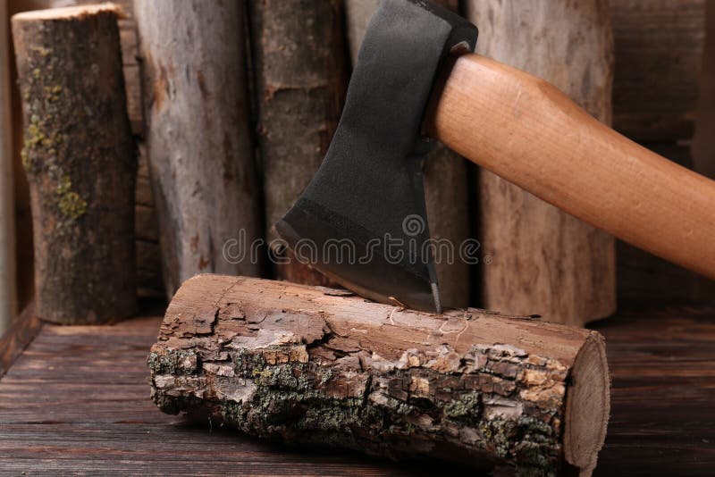 Metal Axe in Wooden Log on Table, Closeup Stock Image - Image of ...