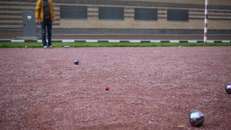 Metal Balls on Playground and Man Throws More Stock Footage - Video of ...