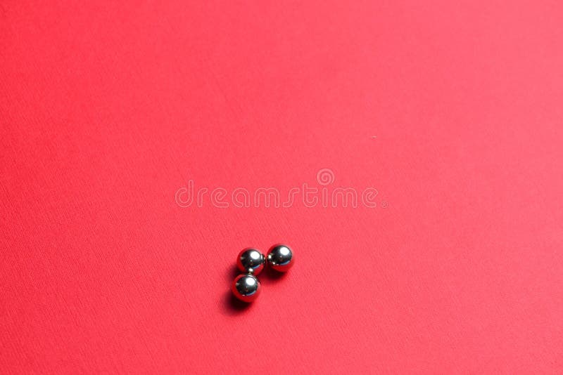 Metal Balls on Red Paper Composition Stock Image - Image of design ...
