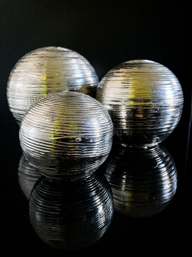 3 Metal Balls Reflected in a Glass Table Stock Image - Image of covered ...
