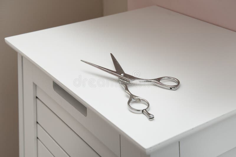 Metal Barber Scissors on a White Chest Stock Photo - Image of modern ...