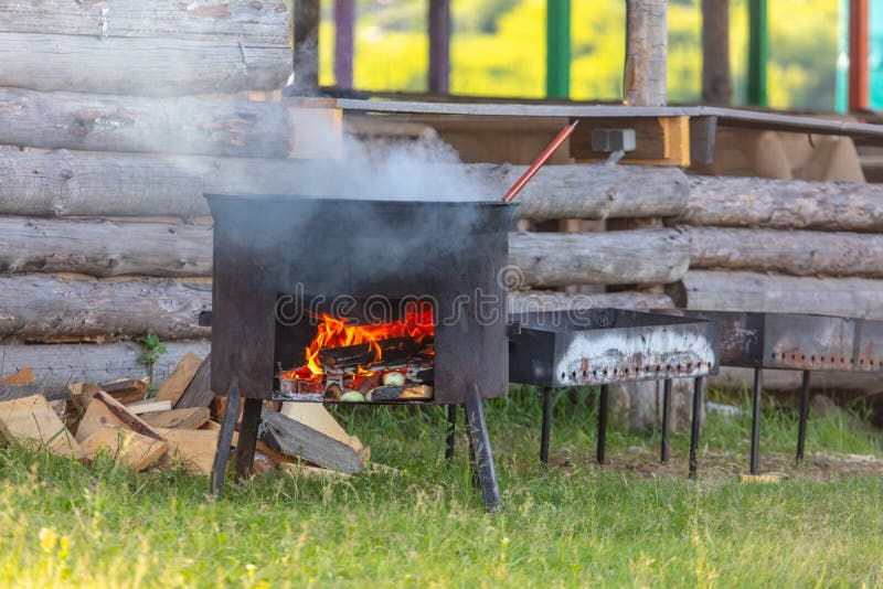 A metal barrel for cooking stock image. Image of cookout - 225632351