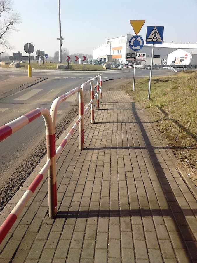 Metal barrier by street editorial photography. Image of handrail ...